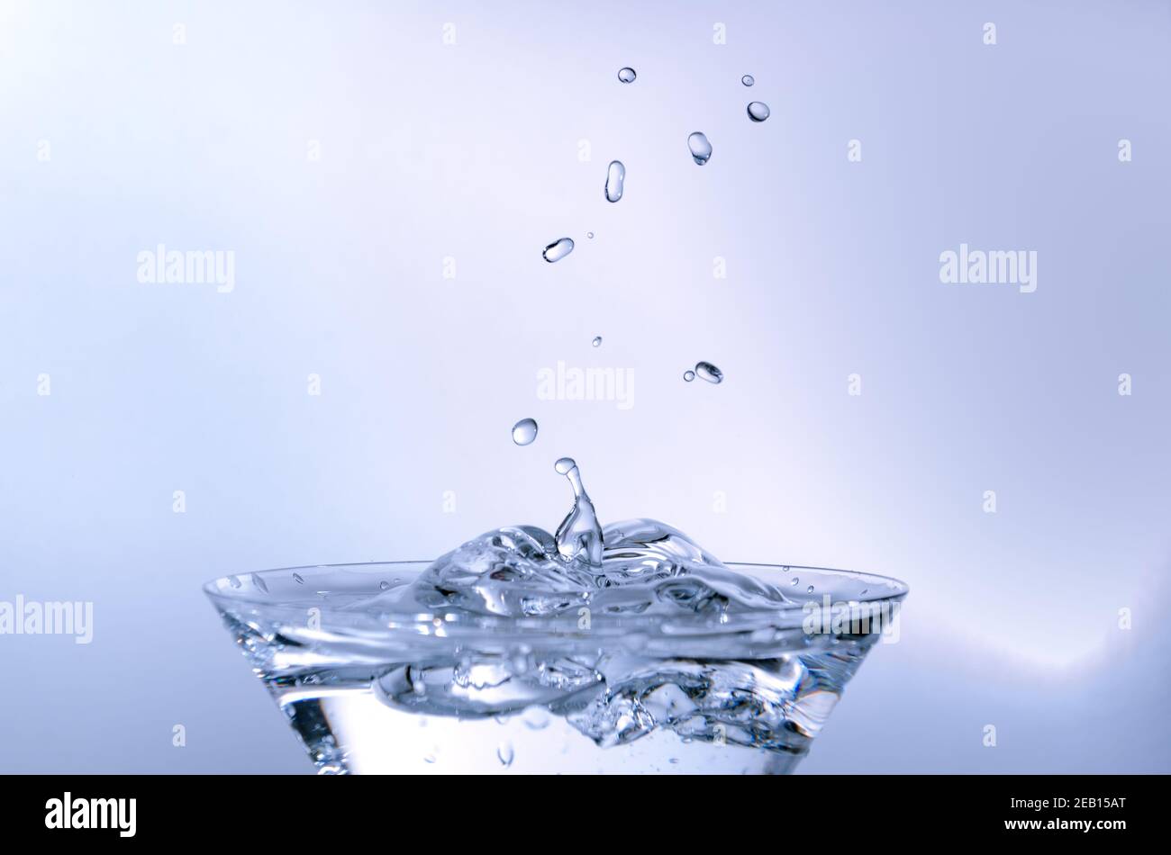 Glass with splashing clear water isolated on a clear background Stock ...