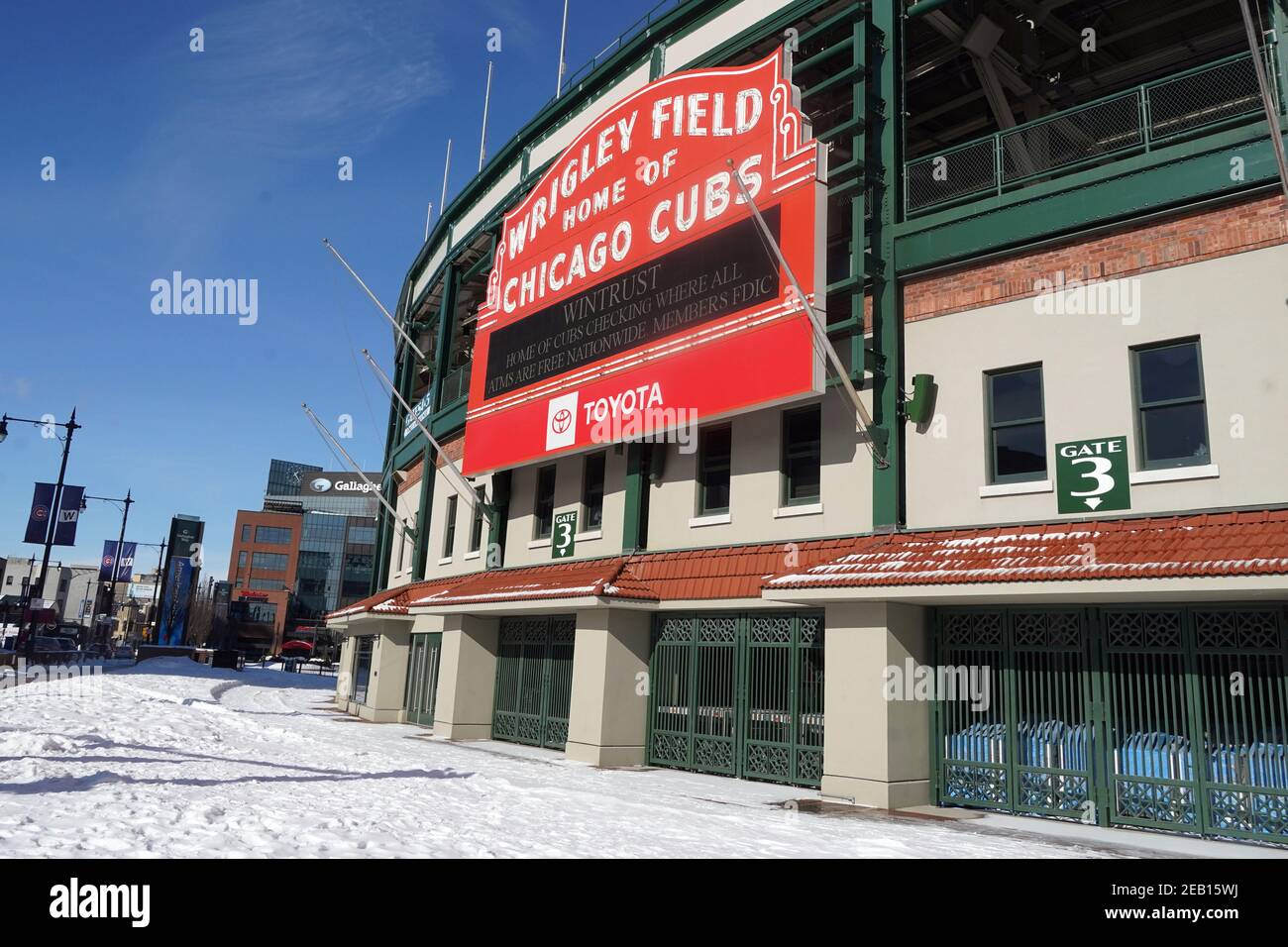 A general view of Wrigley Field and red marquee sign at main entrance ...