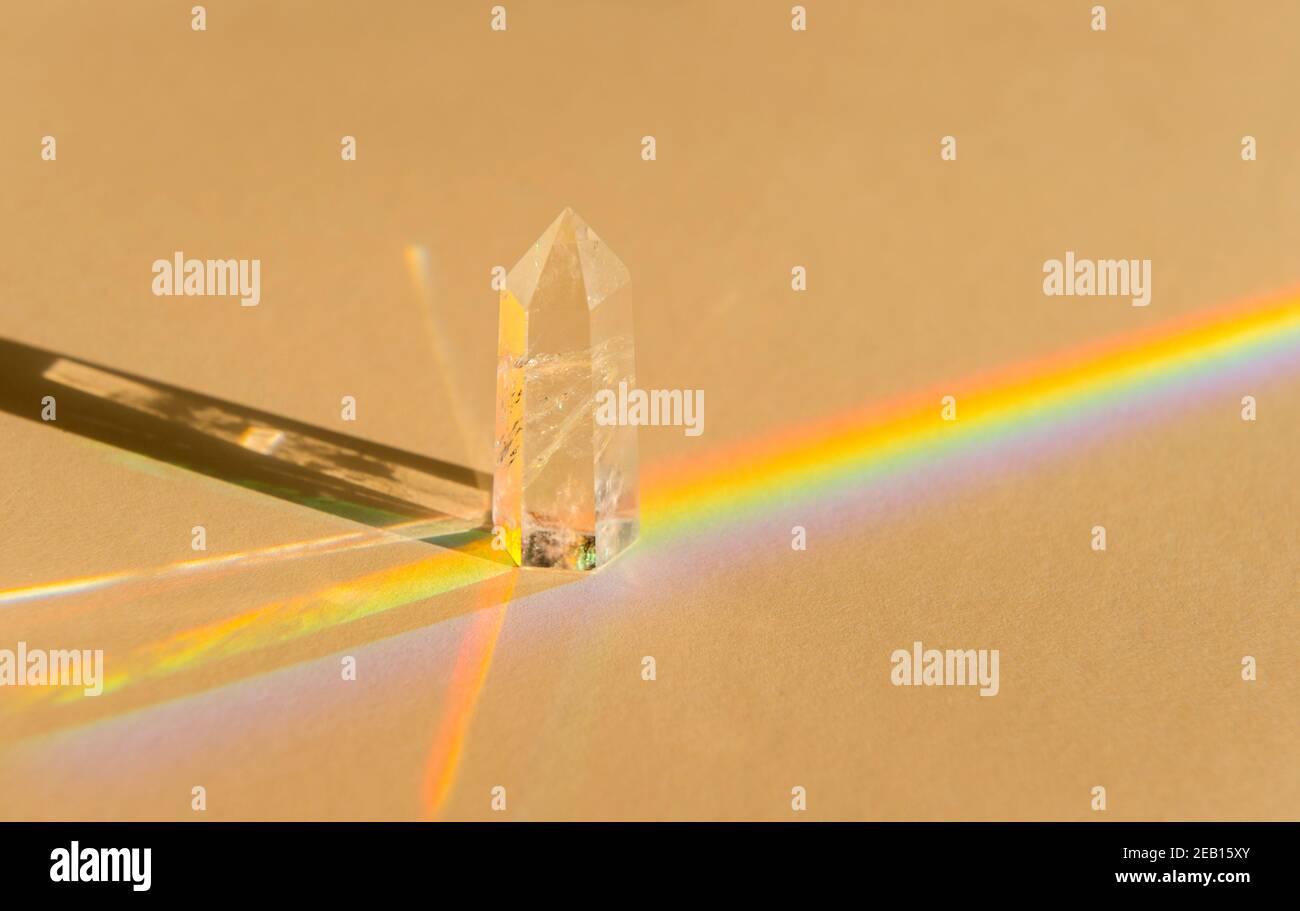 Healing chakra crystal and rainbow on beige background. Meditation ...