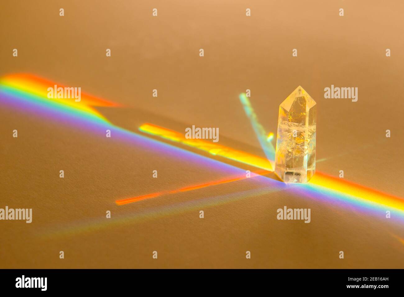 Healing chakra crystal and rainbow on beige background. Meditation ...