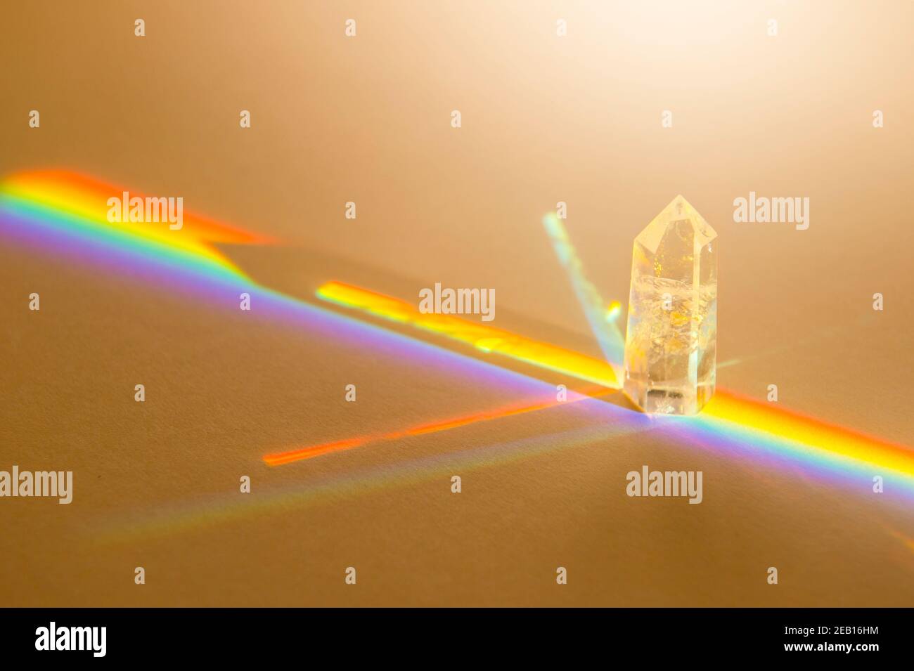 Healing chakra crystal and rainbow on beige background. Meditation ...
