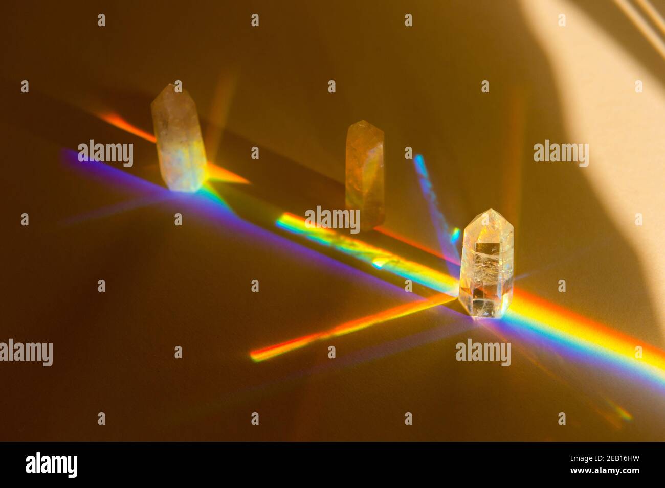 Healing chakra crystal and rainbow on beige background. Meditation ...