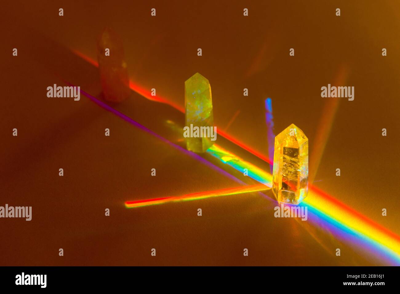 Healing chakra crystal and rainbow on beige background. Meditation ...