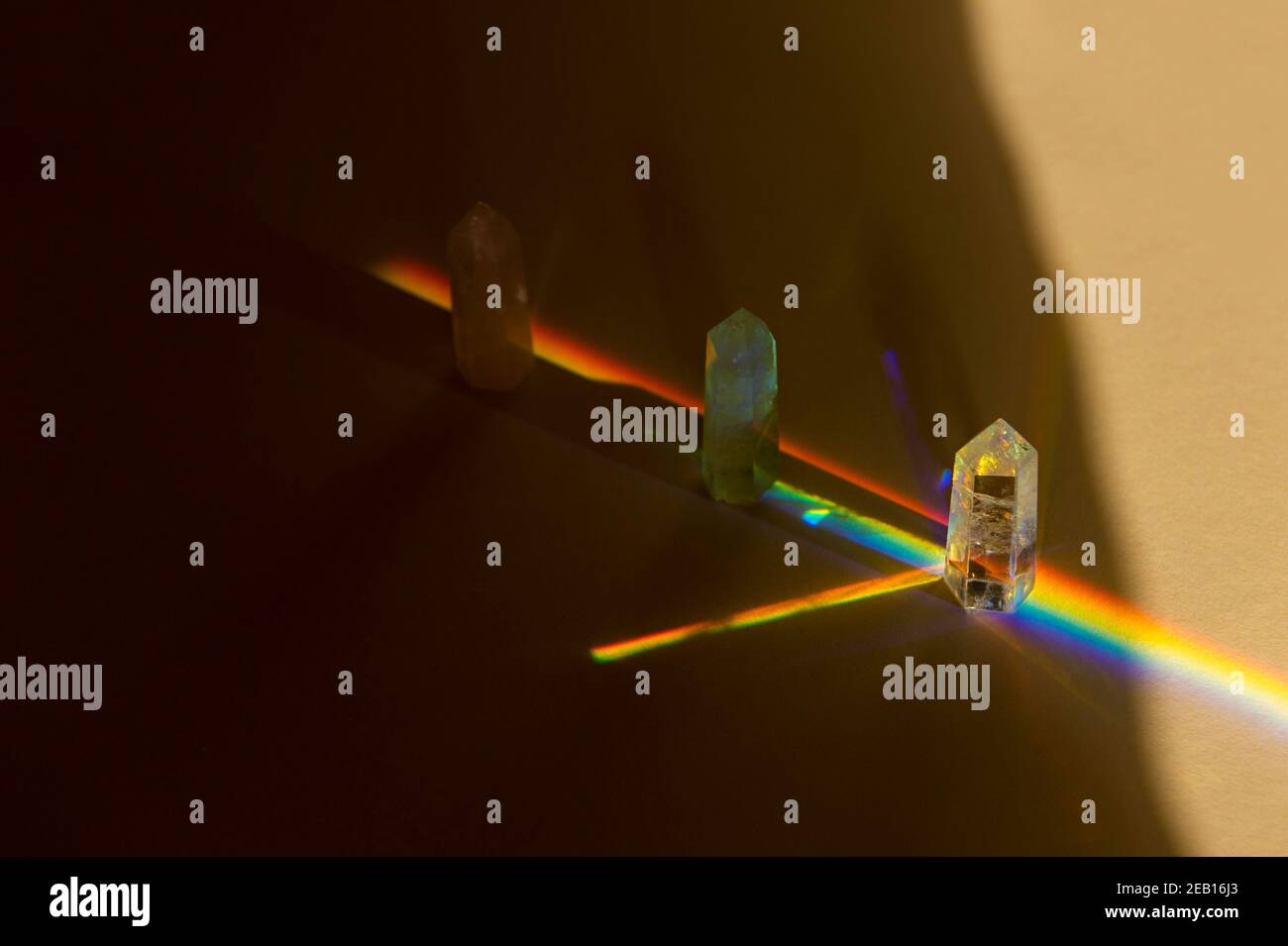 Healing chakra crystal and rainbow on beige background. Meditation ...