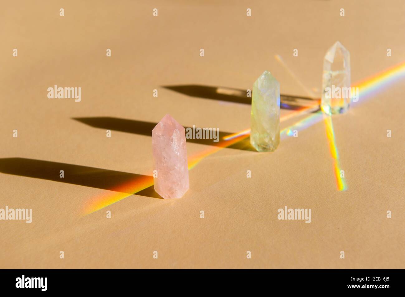 Healing chakra crystal and rainbow on beige background. Meditation ...