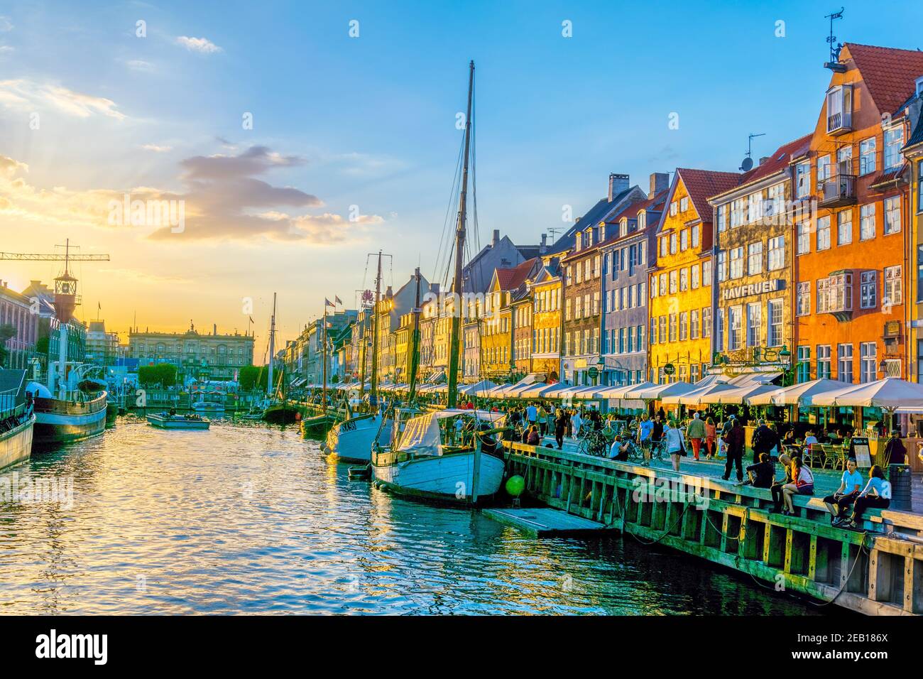 COPENHAGEN, DENMARK, AUGUST 21, 2016: Sunset view of old Nyhavn port in ... COPENHAGEN, DENMARK, AUGUST 21, 2016: Sunset view of old Nyhavn port in ...
