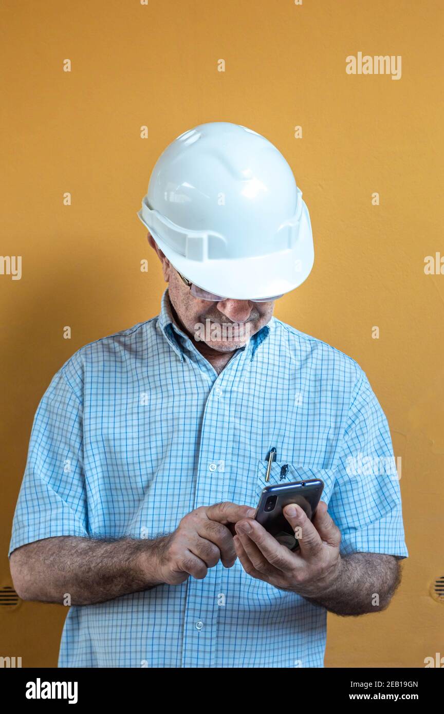 Engineer in suit holding helmet hi-res stock photography and images - Alamy