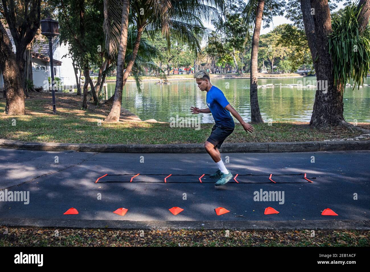 Trainer Shows How to Social Distance and Maintain Fitness Program Stock ...