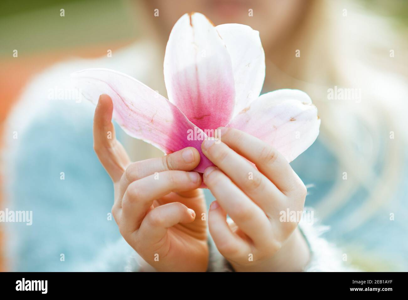 Child with flower in hand hi-res stock photography and images - Alamy