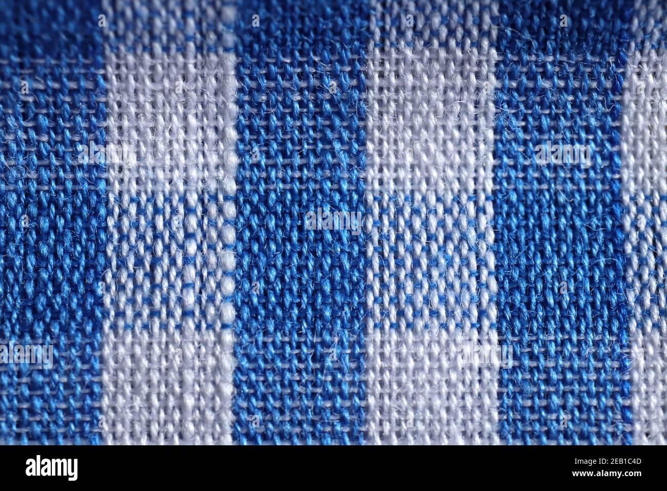 Blue white checkered color fabric background. Colored textile texture ...