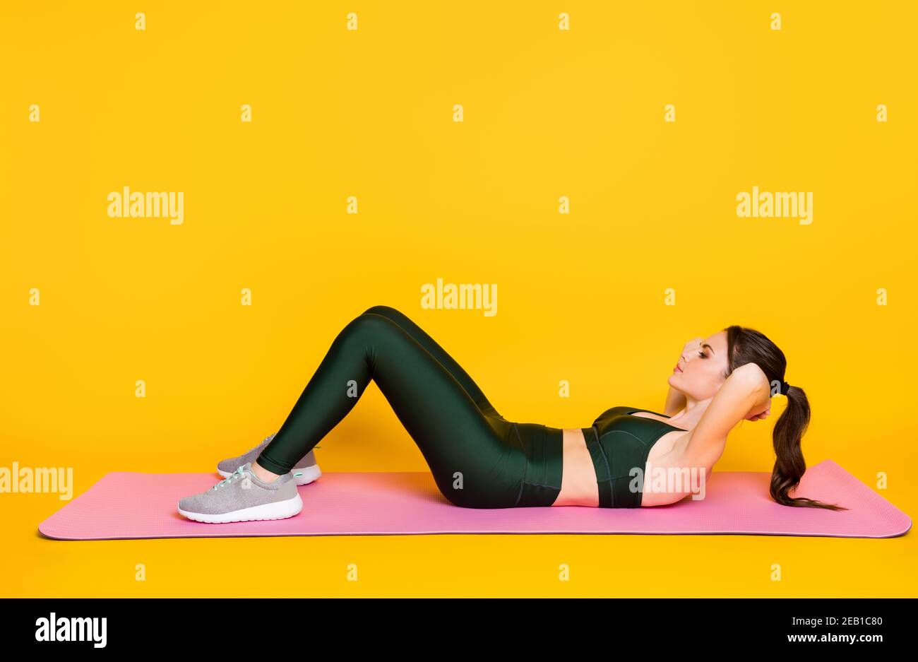 Profile side full body view of nice thin slender focused girl lying on ...