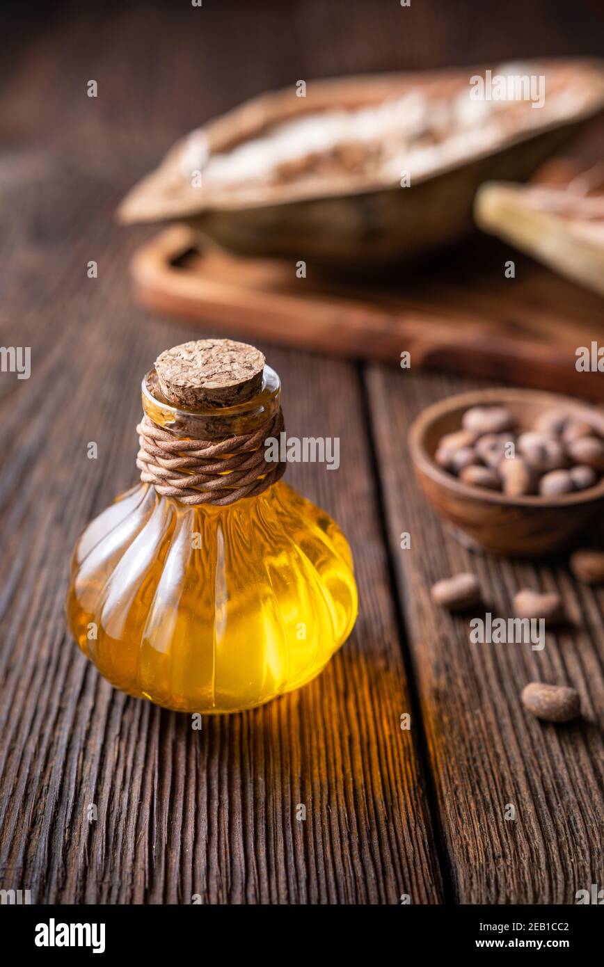 Baobab seed oil in glass bottle for healthy skin and hair on rustic ...
