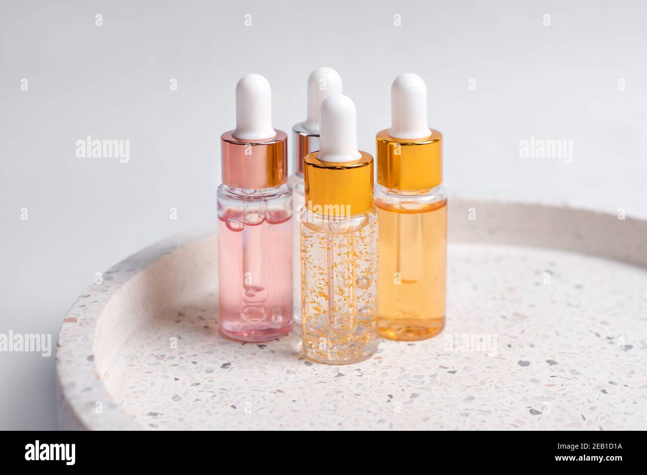 Hydrating anti aging serum with collagen and peptides in glass bottle ...