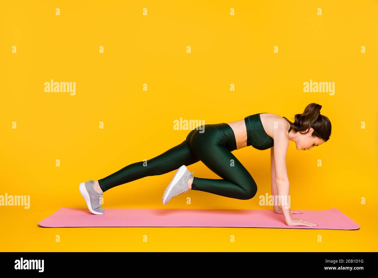 Profile side full body view of attractive slender sportive girl doing ...