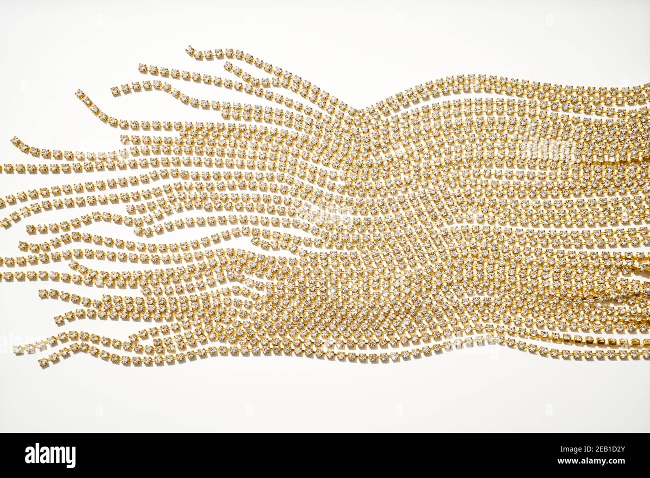 Strass strands on a white background, beautifully laid out in waves ...