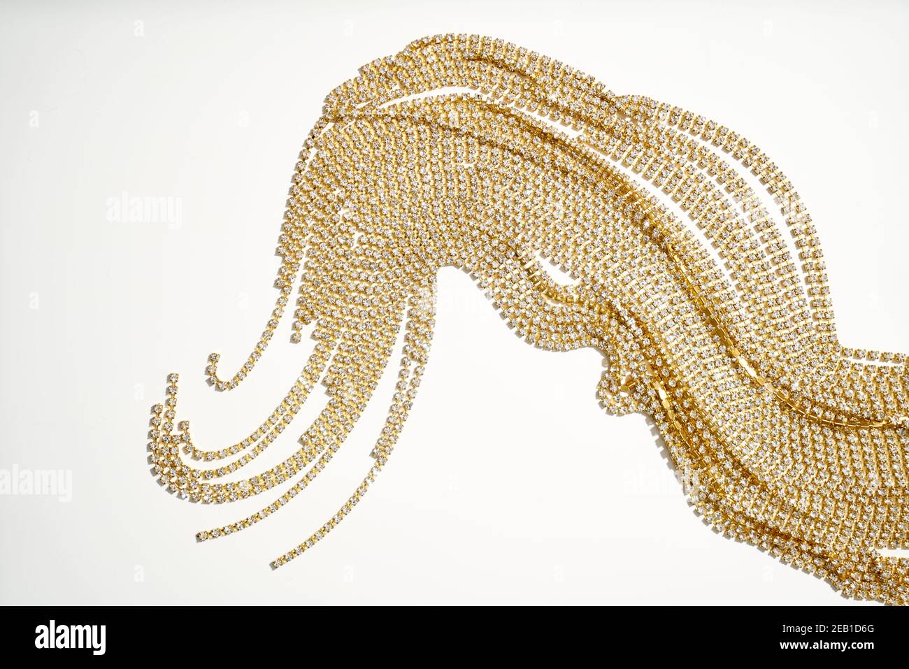 Strass strands on a white background, beautifully laid out in waves ...