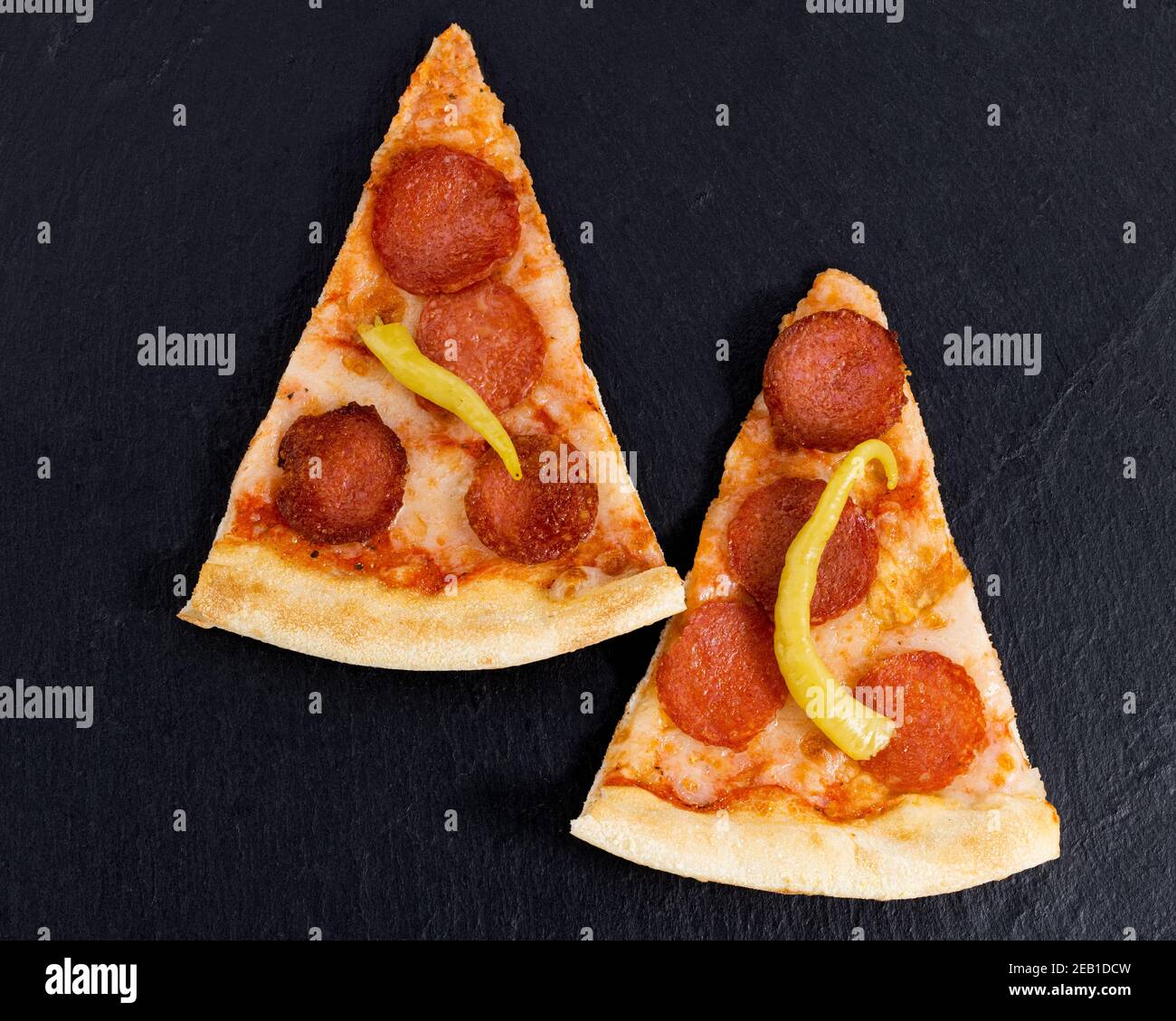 slice of pepperoni pizza on wood background . Top view of hot pepperoni ...