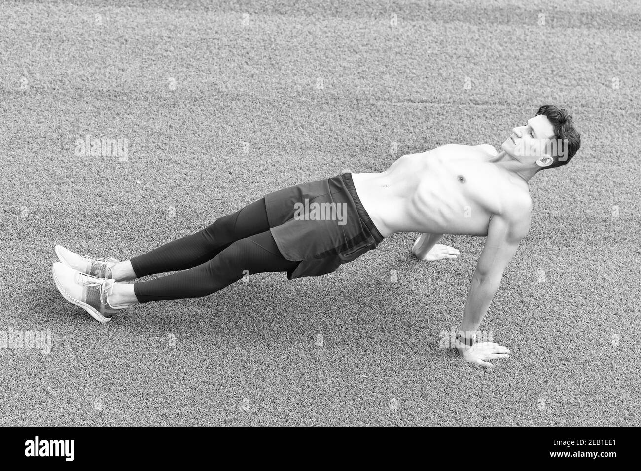 Reverse plank helps strengthen lower back, man exercising outdoors ...