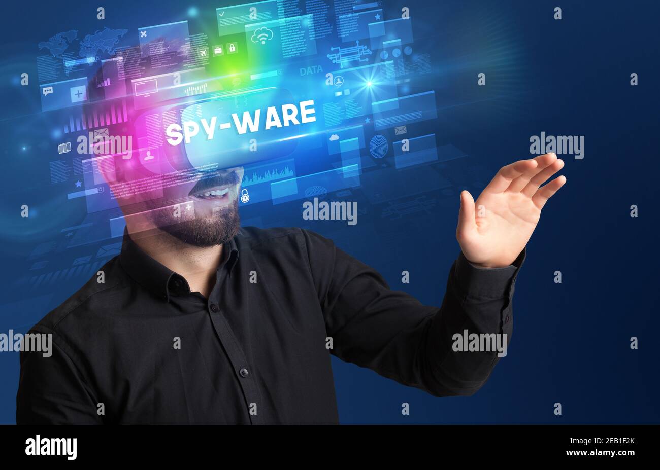 Businessman looking through Virtual Reality glasses with SPY-WARE ...