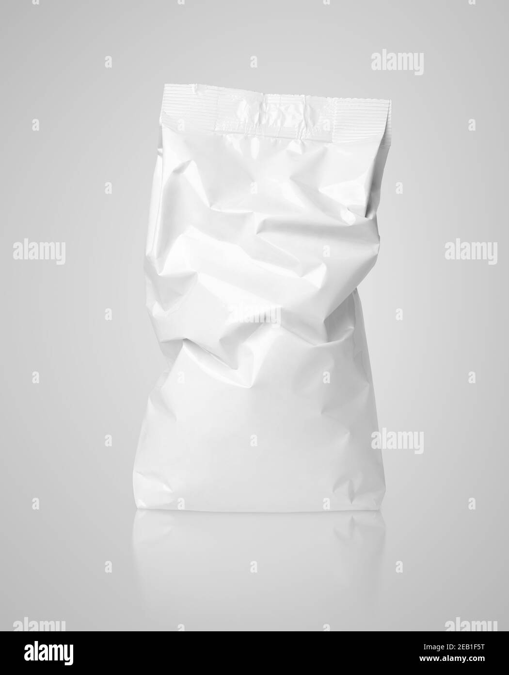White crumpled blank paper bag package with creases on gray with ...