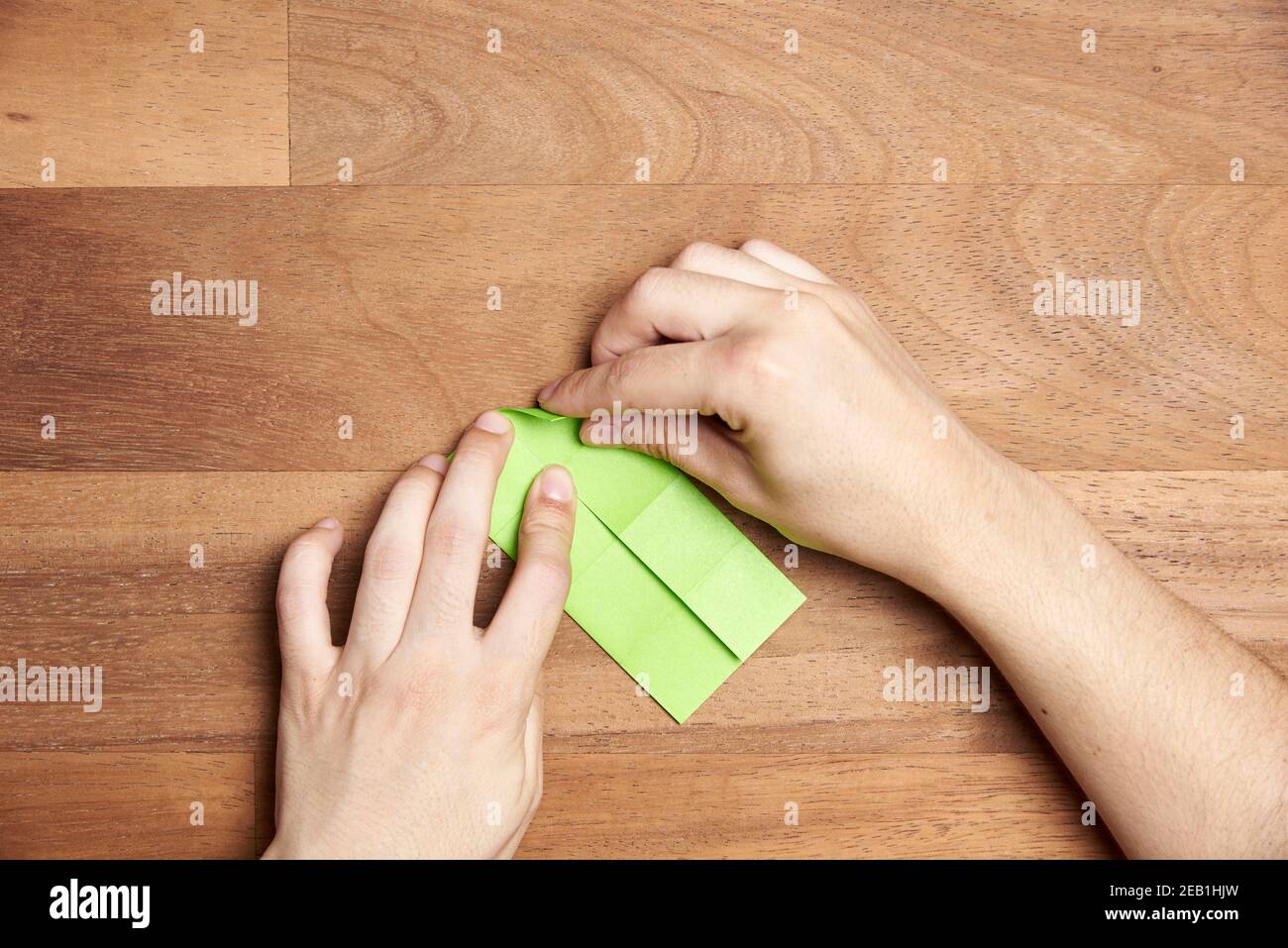 Woman folding paper origami hi-res stock photography and images - Alamy