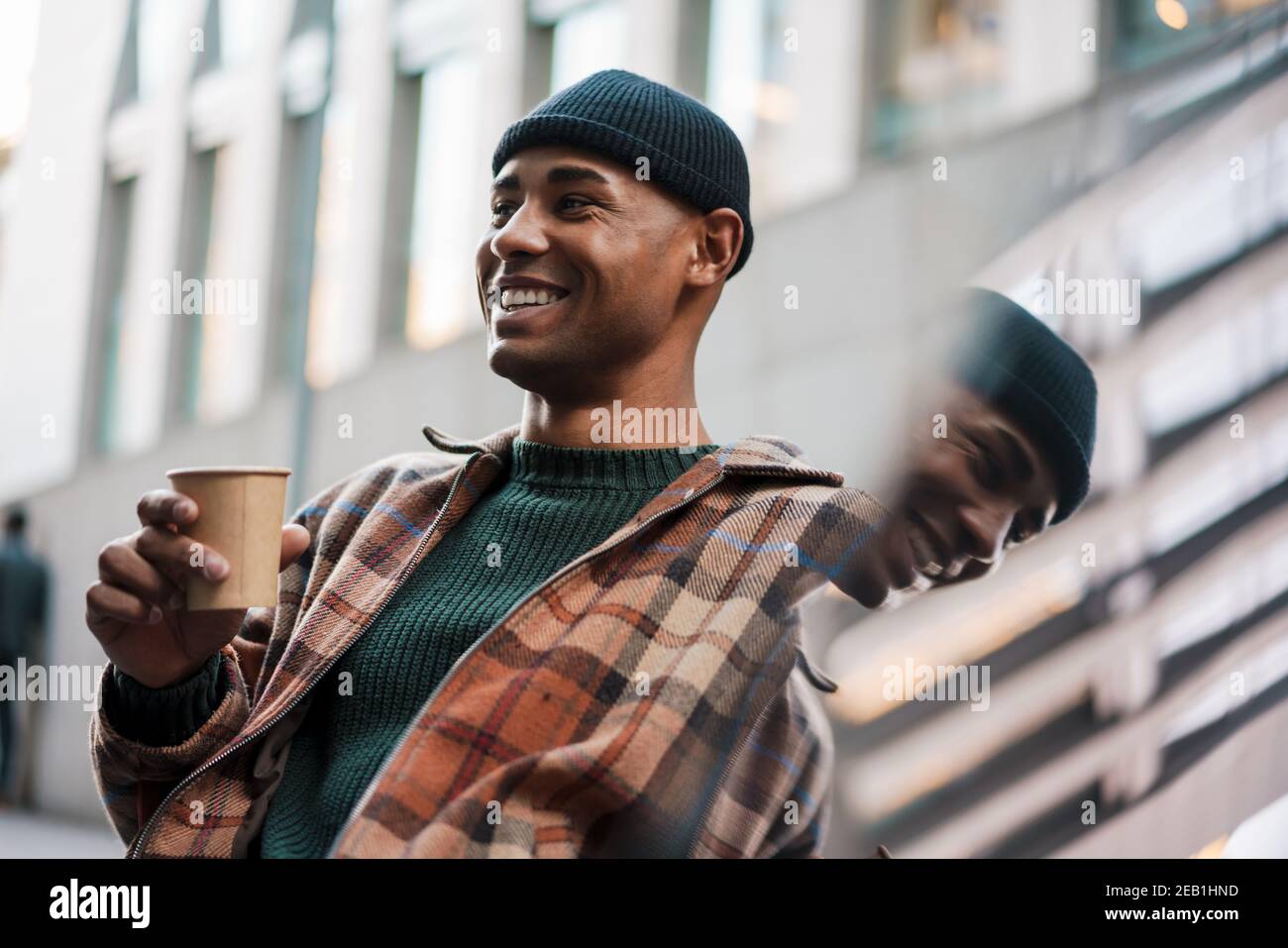Black man drinking coffee walking hi-res stock photography and images ...