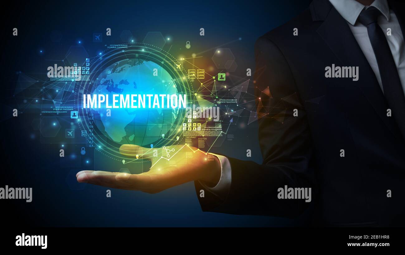 Elegant hand holding IMPLEMENTATION inscription, digital technology ...