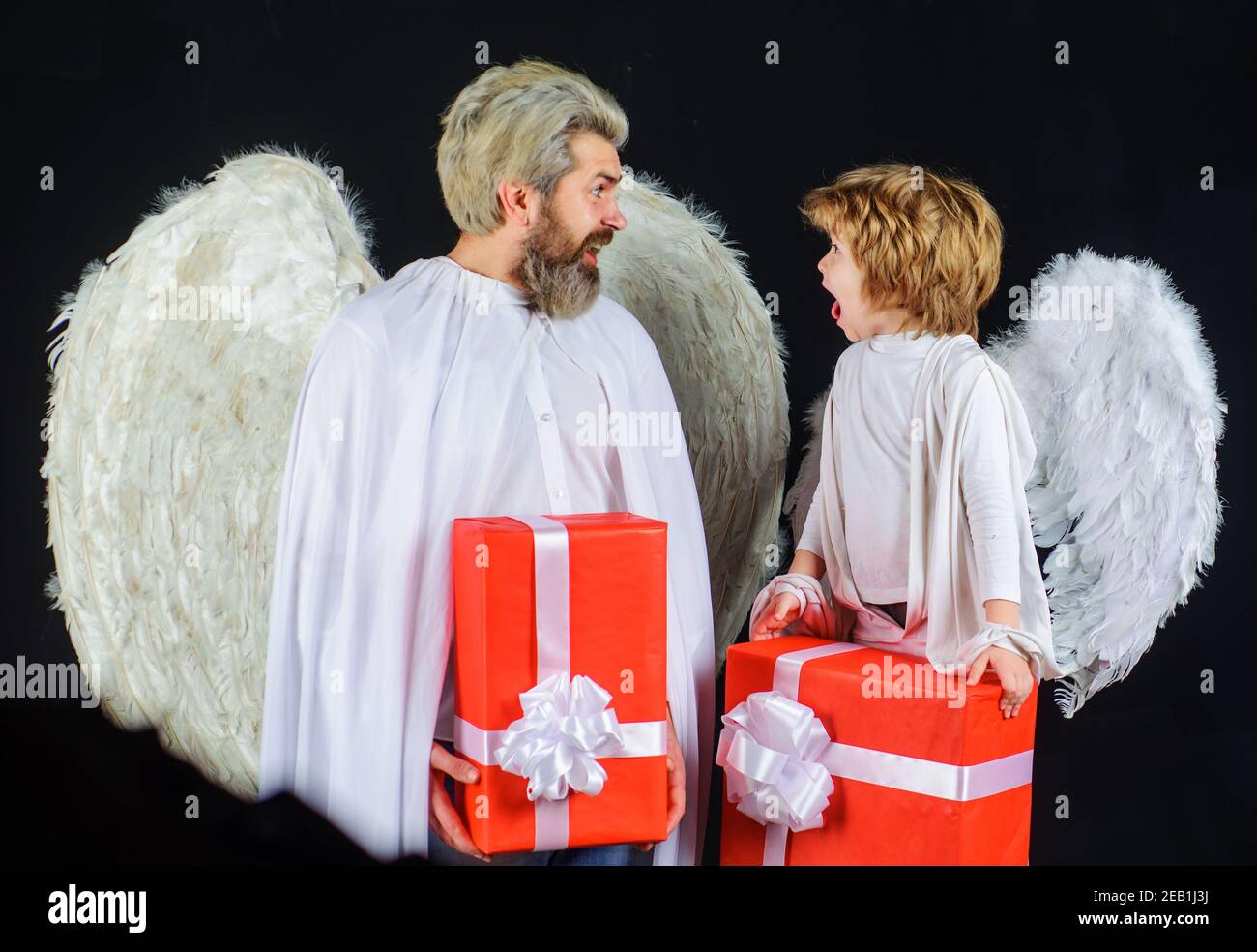 Valentines angel. Father and son Angels with red gift. Happy man family ...