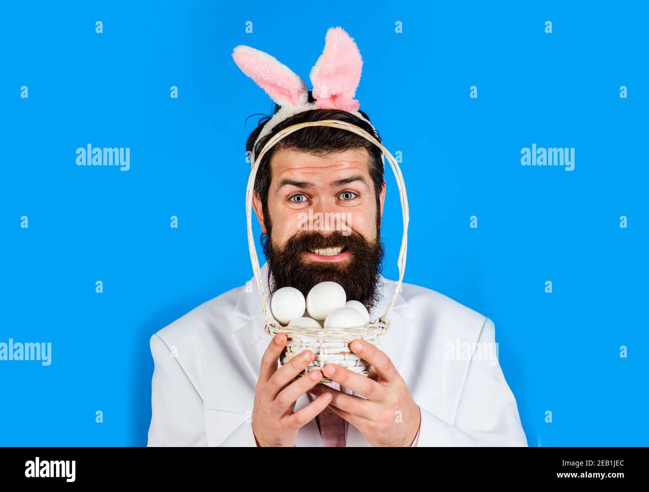 Happy Easter. Man in bunny ears with basket eggs. Funny bunny guy Stock ...