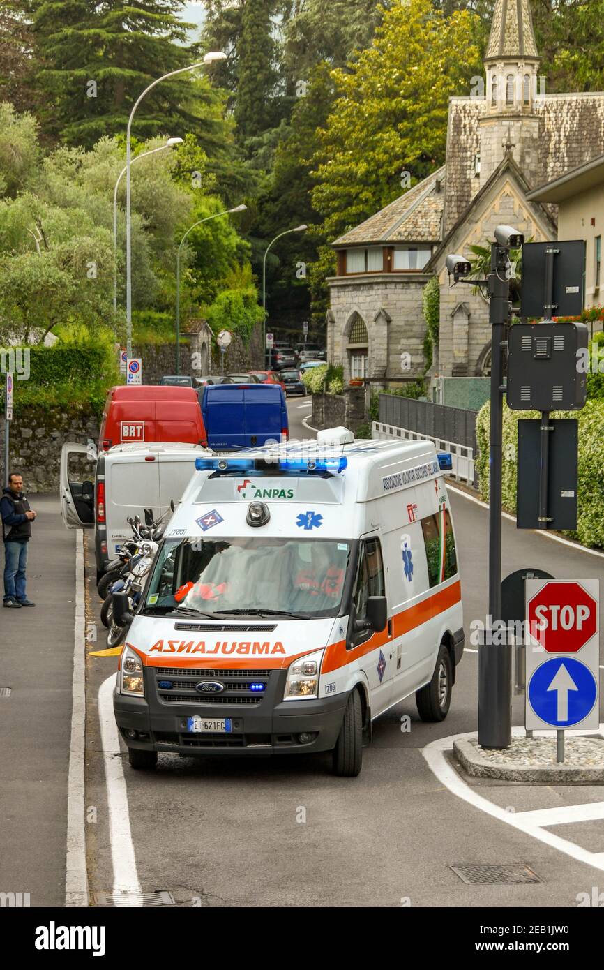 BELLAGIO, LAKE COMO, ITALY - JUNE 2019: Emergency ambulance with blue ...