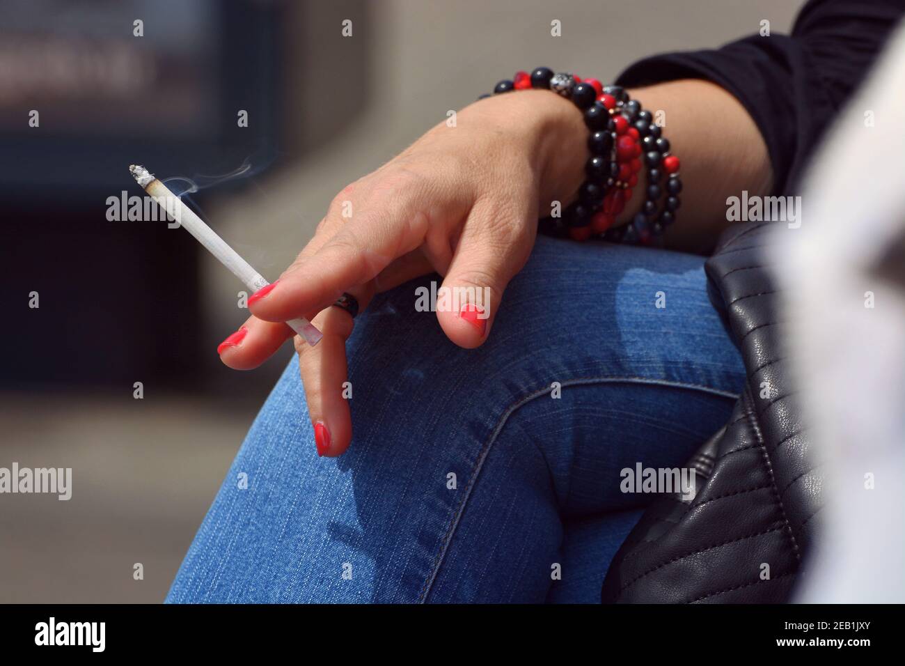 Cigarette in hand hi-res stock photography and images - Alamy