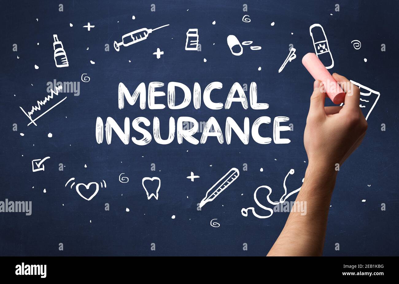 Hand drawing MEDICAL INSURANCE inscription with white chalk on ...