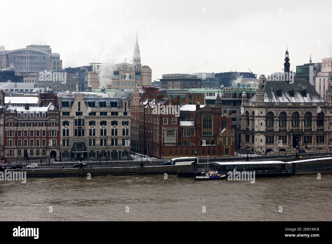 office buildings covered in snow near Blackfriars bridge, embankment ...