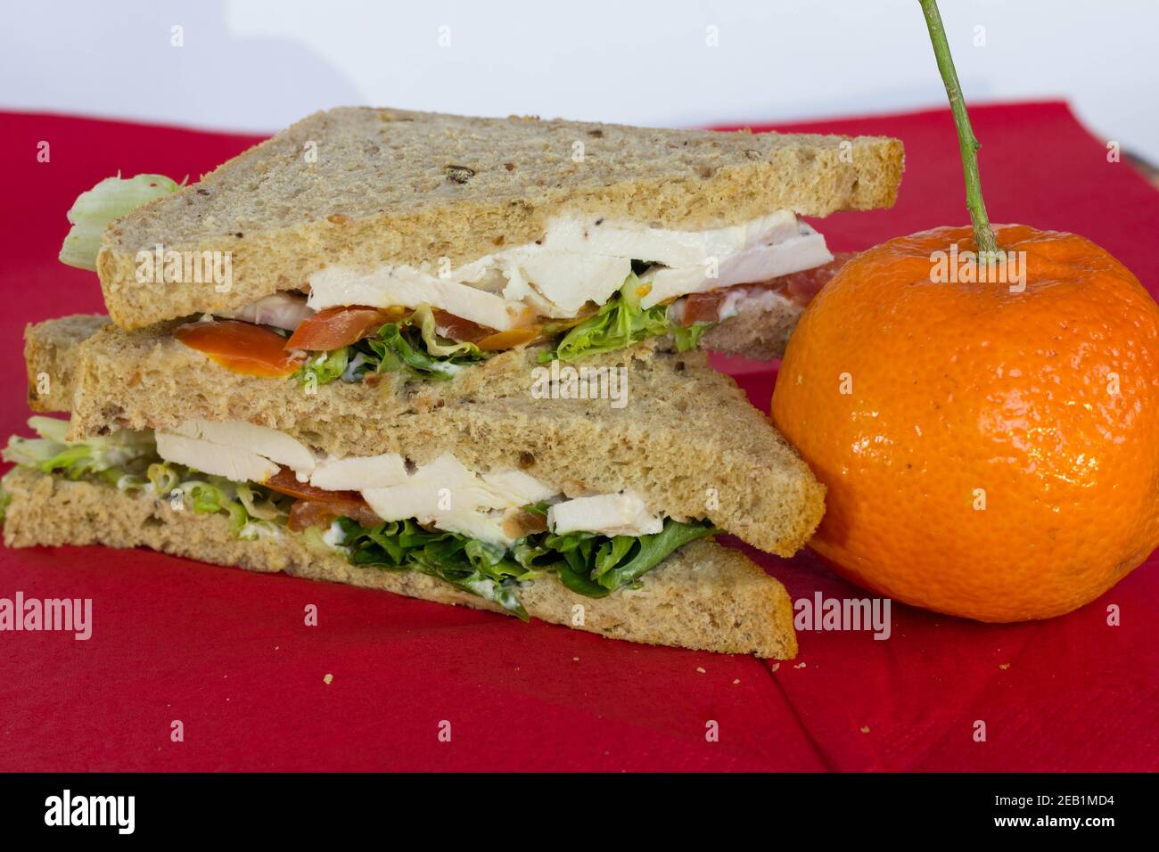 chicken salad sandwiches pack lunch with orange Stock Photo - Alamy