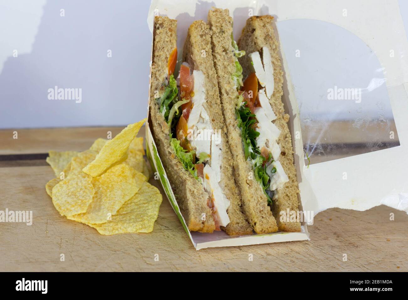 chicken salad sandwiches pack lunch with crisps Stock Photo - Alamy
