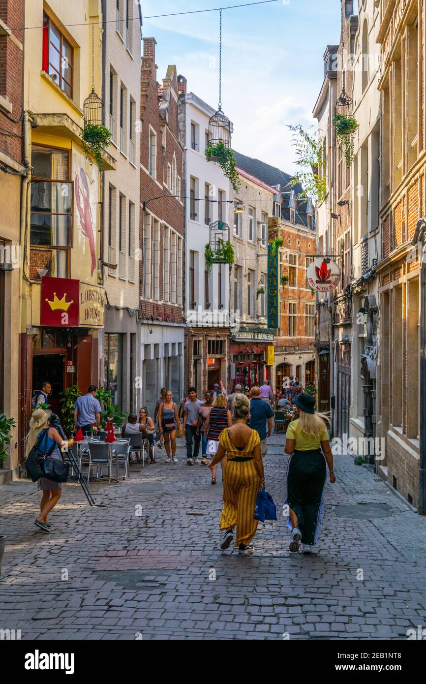 BRUSSELS, BELGIUM, AUGUST 4, 2018: People are strolling on a street in ...
