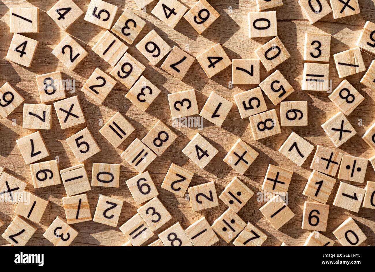 Scattered wooden plaques with numbers and signs. Flat lay. Teaching ...