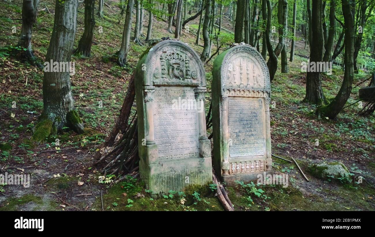 Full shot two tombstones in old cemetery. Headstones in Jewish Stock ...