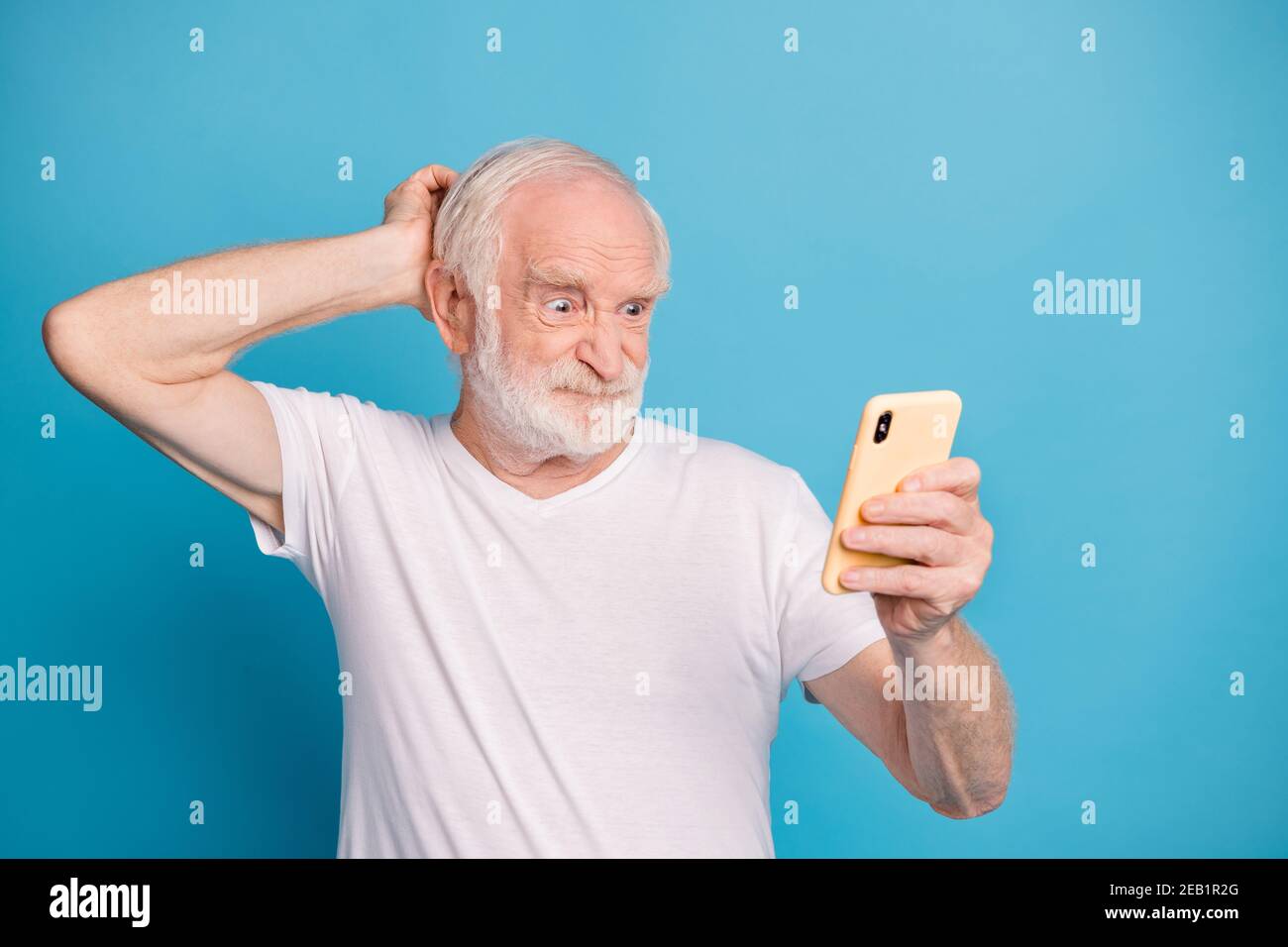 Portrait of unsatisfied person hand behind head staring phone grimace ...
