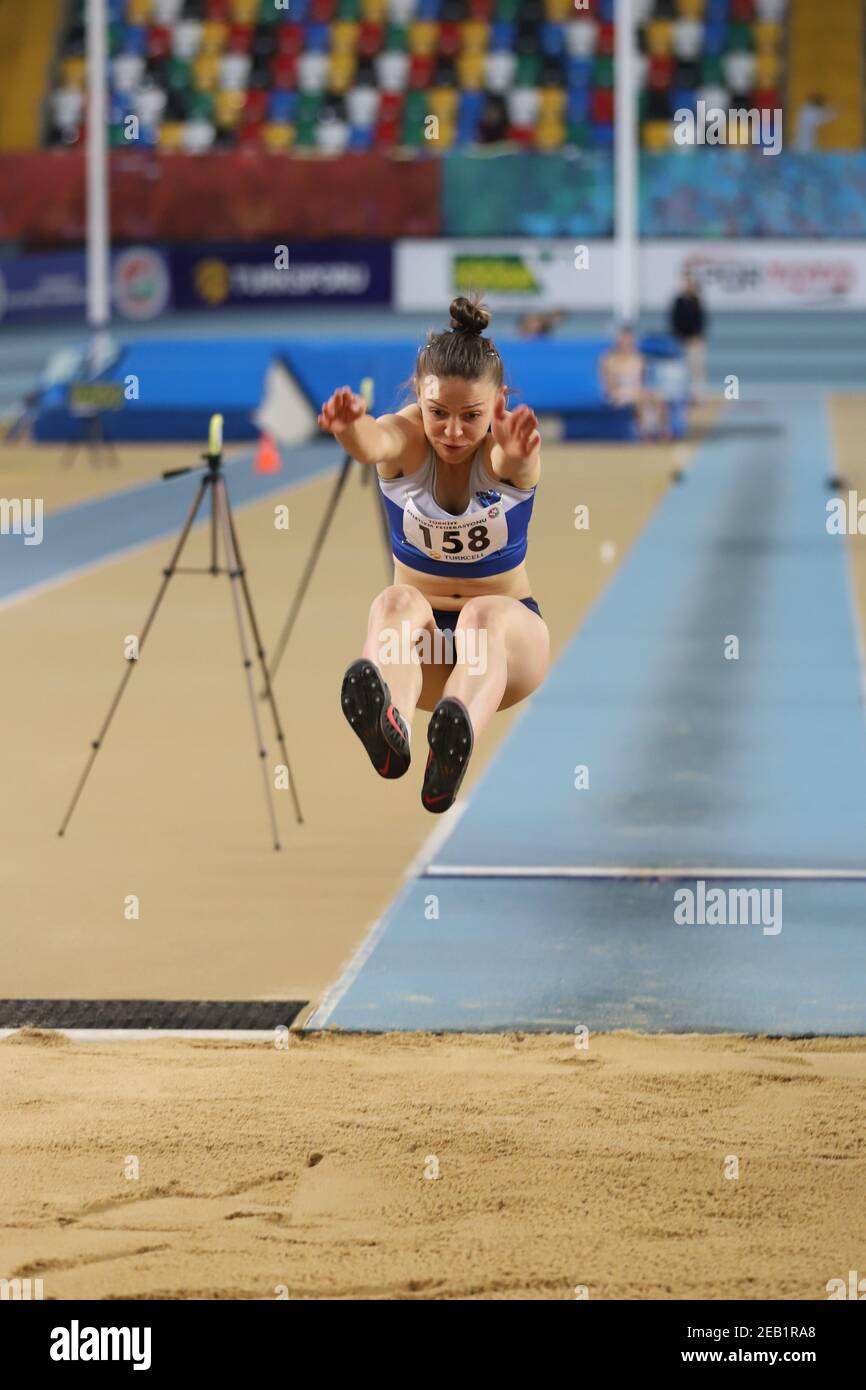 ISTANBUL, TURKEY - FEBRUARY 06, 2021: Undefined athlete long jumping ...