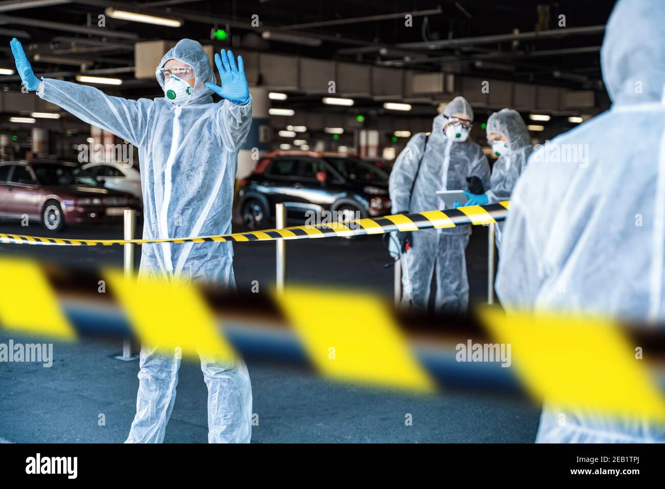 Healthcare worker showing stop gesture. Team of healthcare workers ...