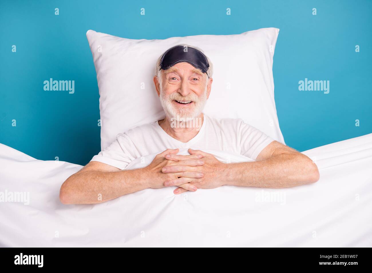Photo of satisfied aged person covered blanket folded fingers palms ...