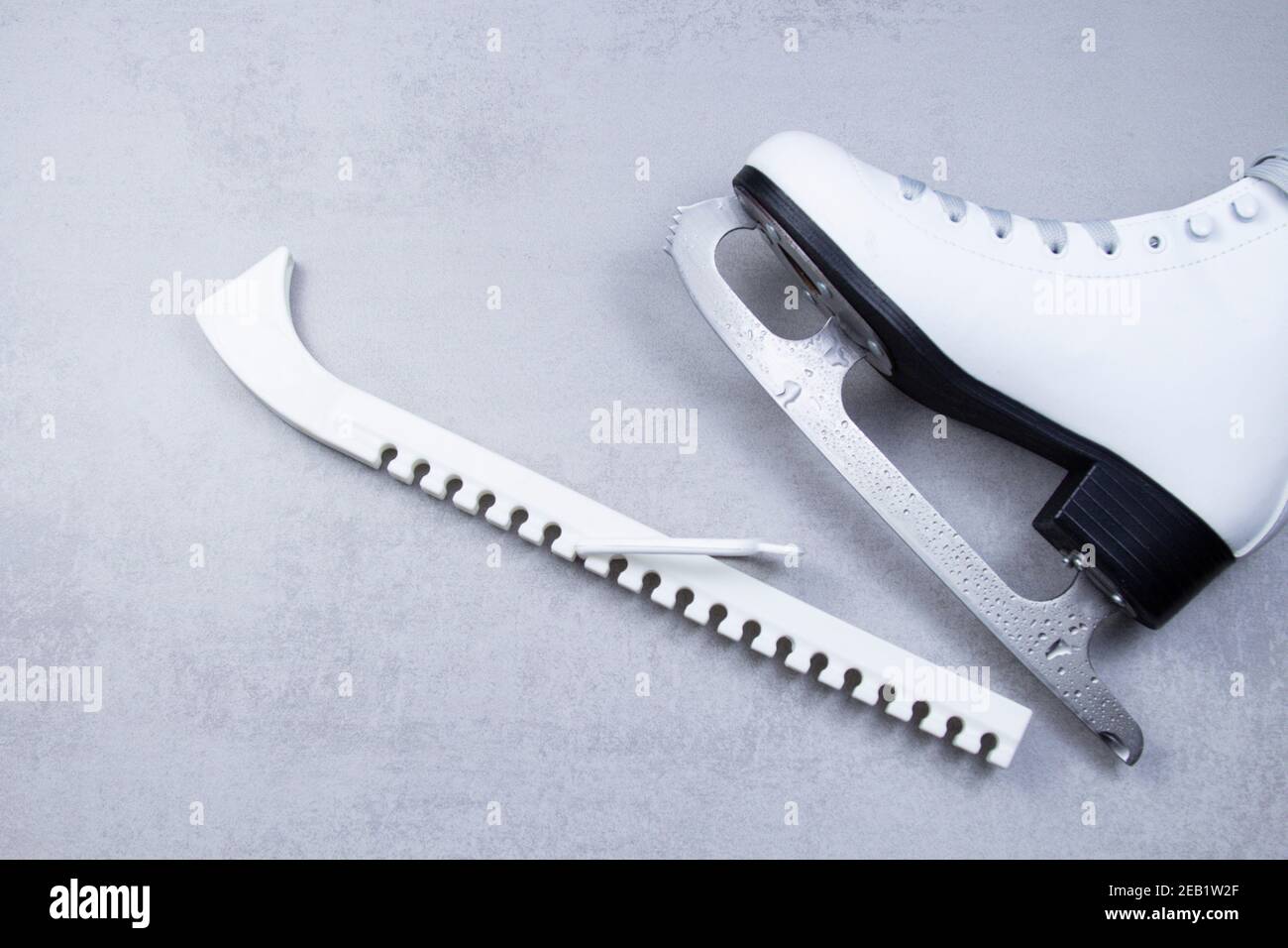 White ice skates for figure skating lie on a light background Stock ...