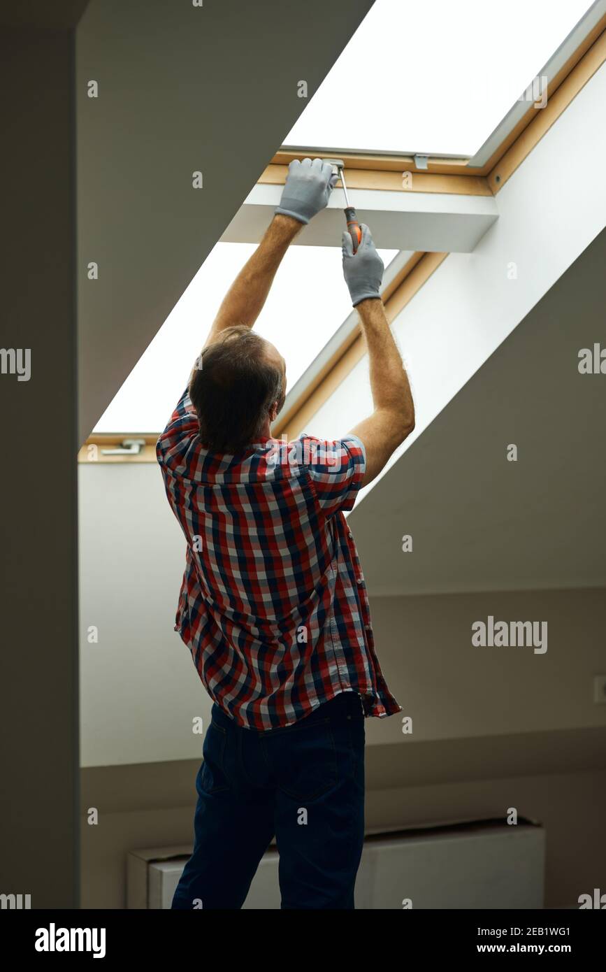 Fixing window construction hi-res stock photography and images - Alamy