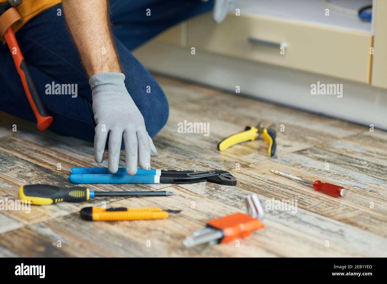 Tools to succeed. Close up of hand of repairman, professional plumber ...