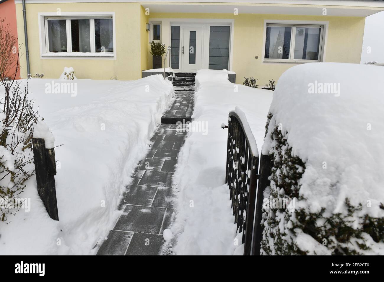 Snow Removal From The House Stock Photo - Alamy