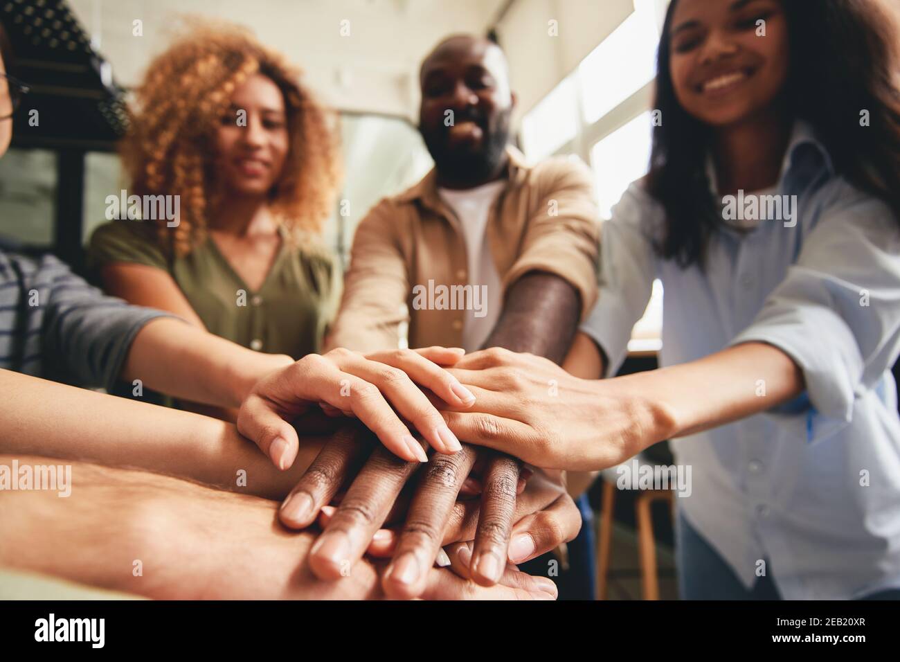 People of different ethnicities uniting to cooperate together Stock ...