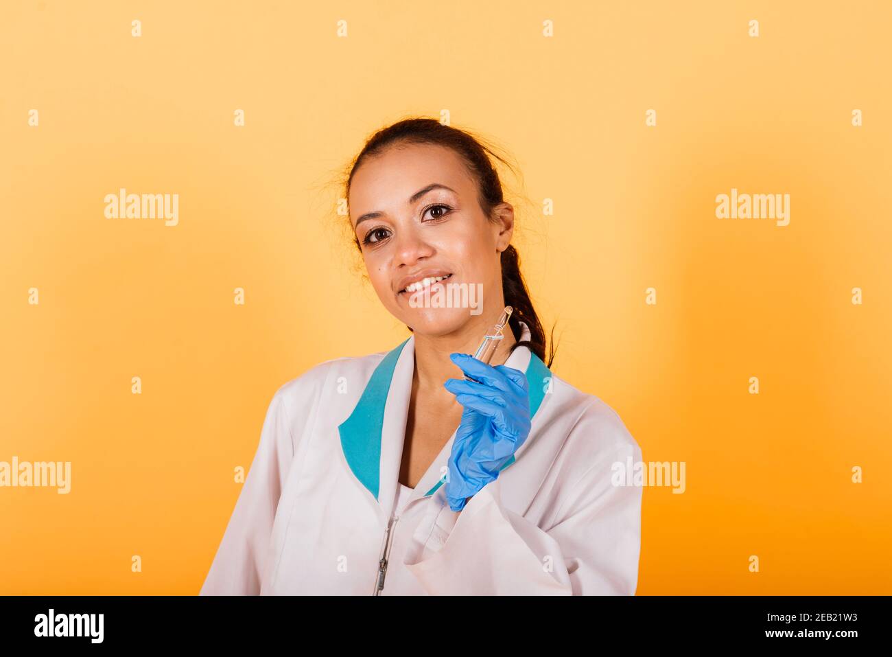 Female medical professional scientist researcher holding a syringe ...