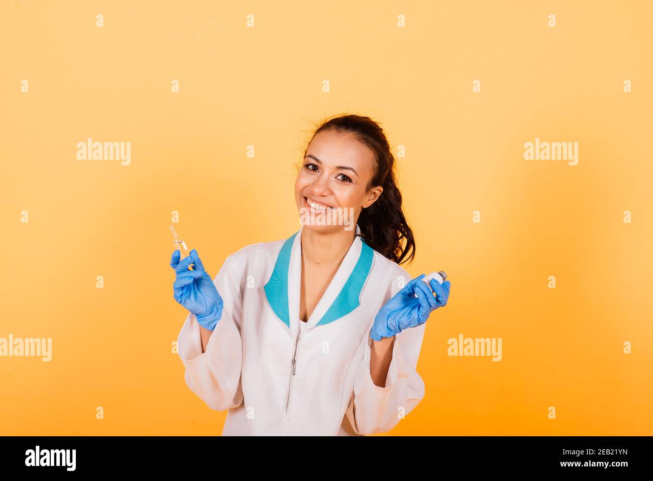 Female medical professional scientist researcher holding a syringe ...