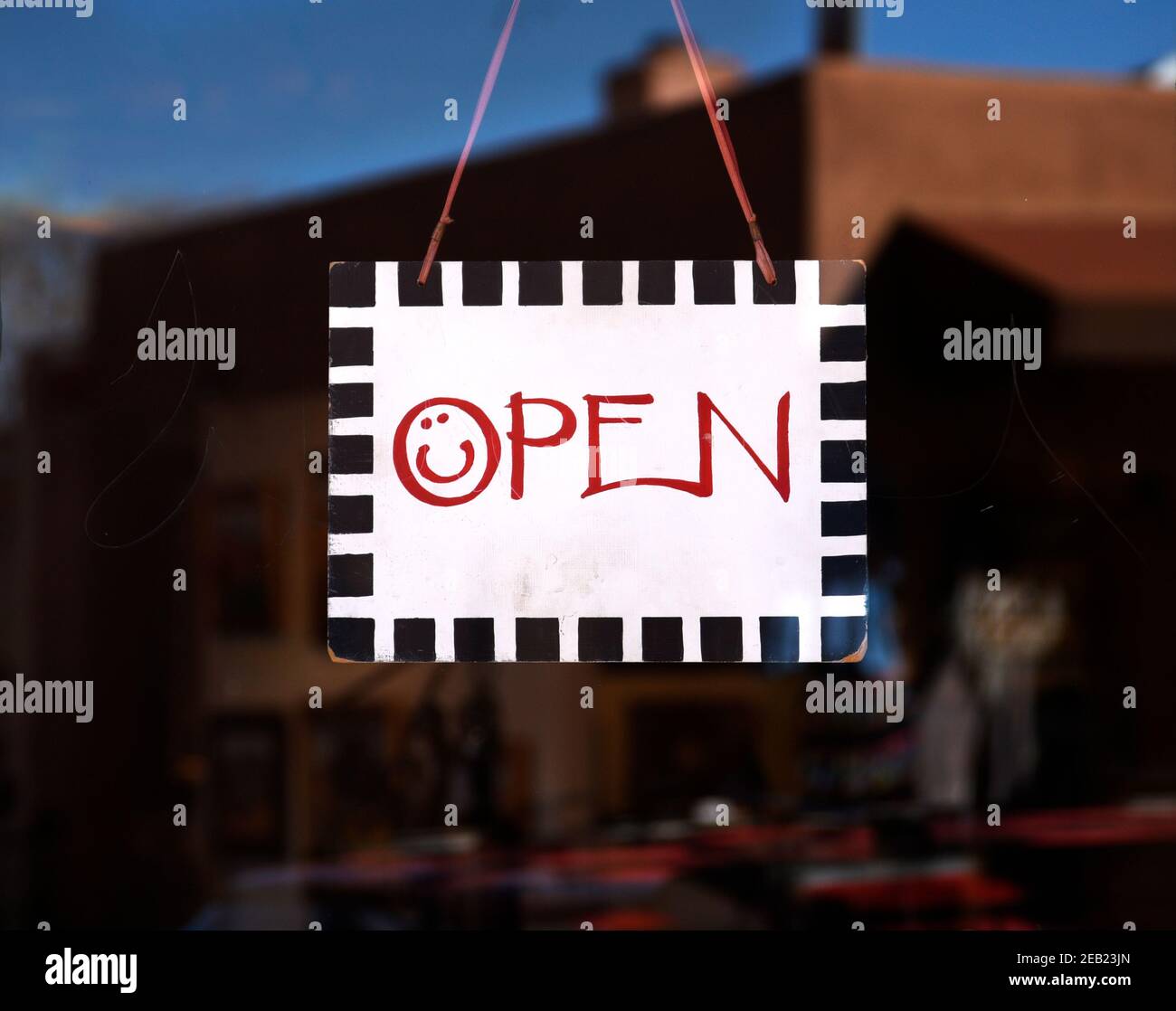 A Open sign in the window of a shop in Santa Fe, New Mexico Stock Photo ...